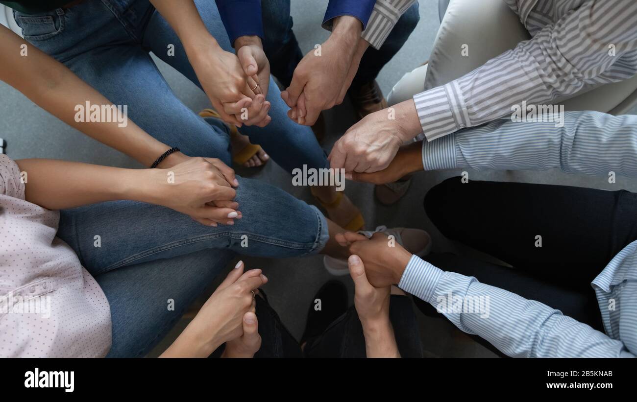 People hold hands circle together hi-res stock photography and images ...