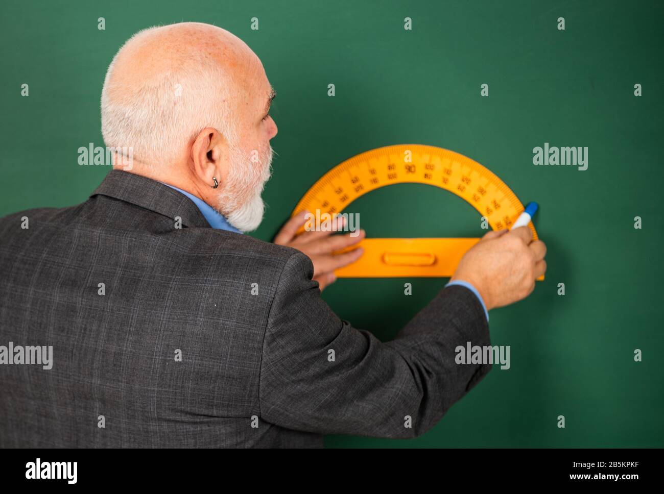senior man teacher use protractor tool. bearded tutor man draw with ...