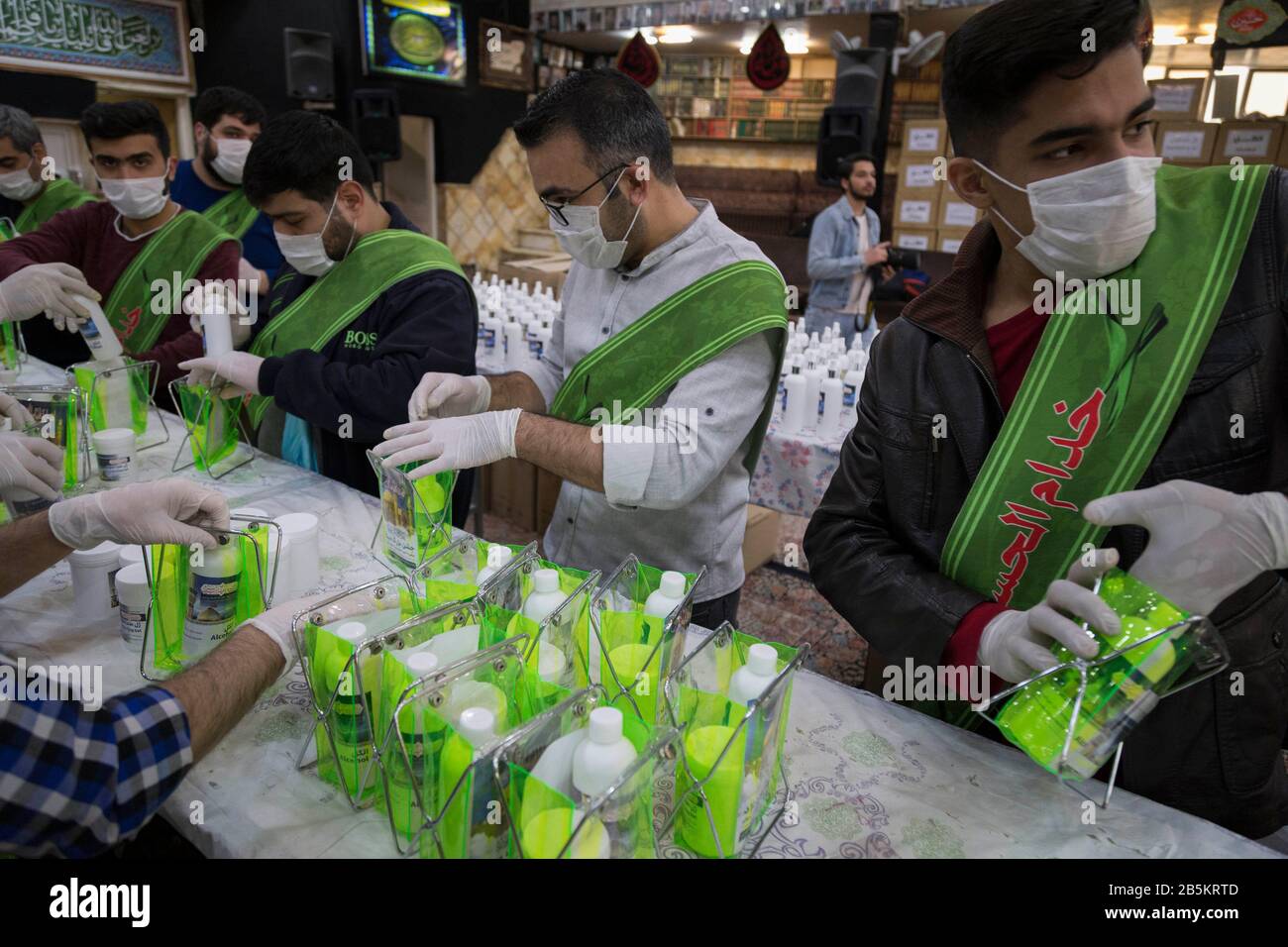Tehran, Iran. 8th Mar, 2020. Iraqis residing in Iran pack face masks ...