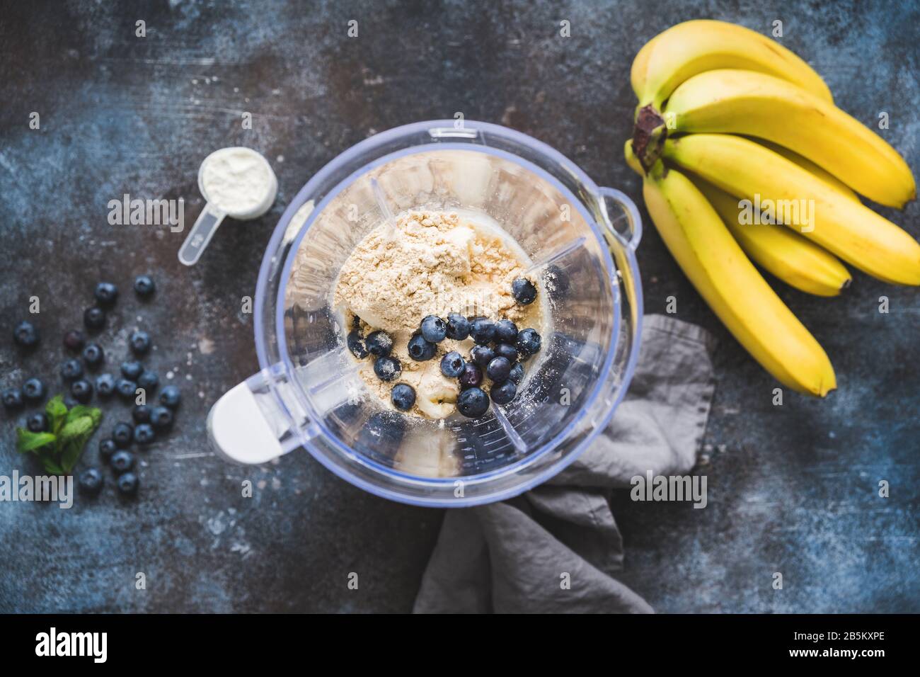 Blueberry protein powder in blender, smoothie preparation, top view ...