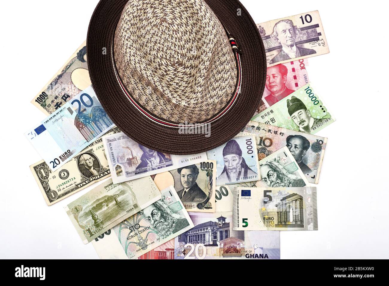 Travel around the world concept with straw hat and mixture of western ...