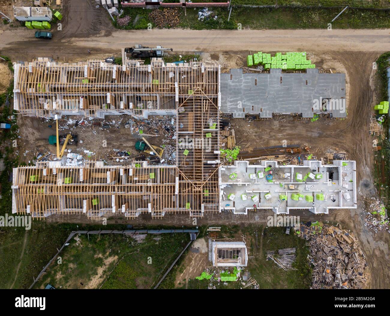 Aerial view on a construction site in progress. Industrial zone. Dirty ...