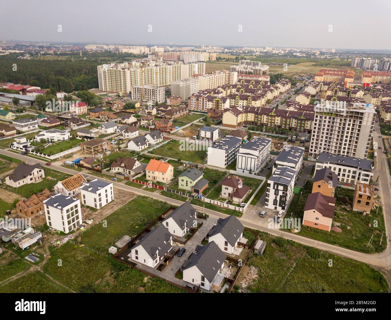 Suburban development of neighborhoods with high-rise buildings and one ...