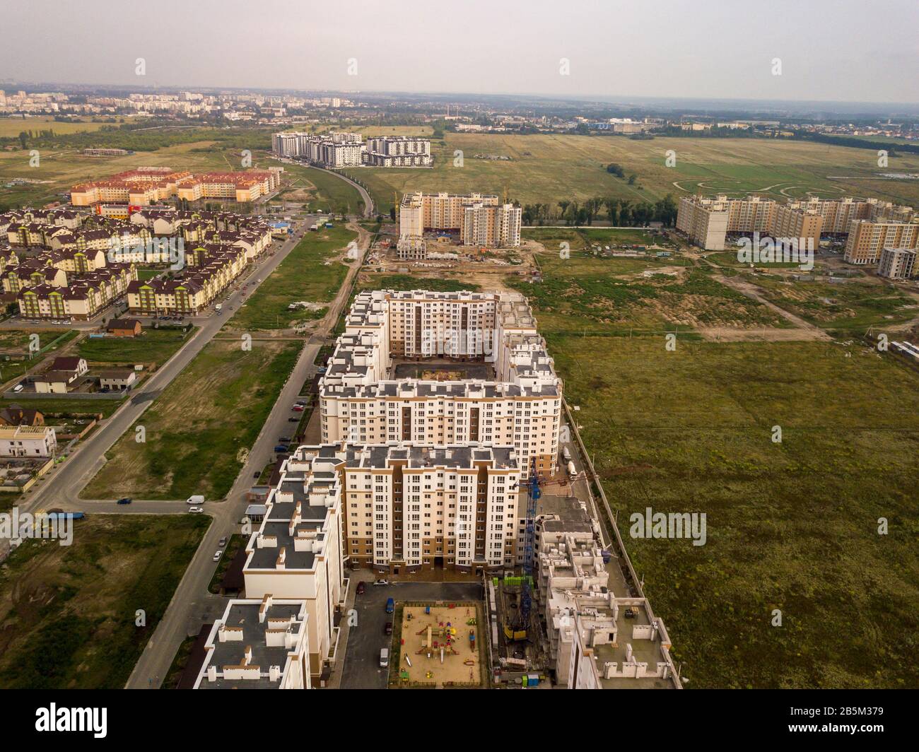 View of high-rise buildings with the playgrounds of neighborhoods in ...