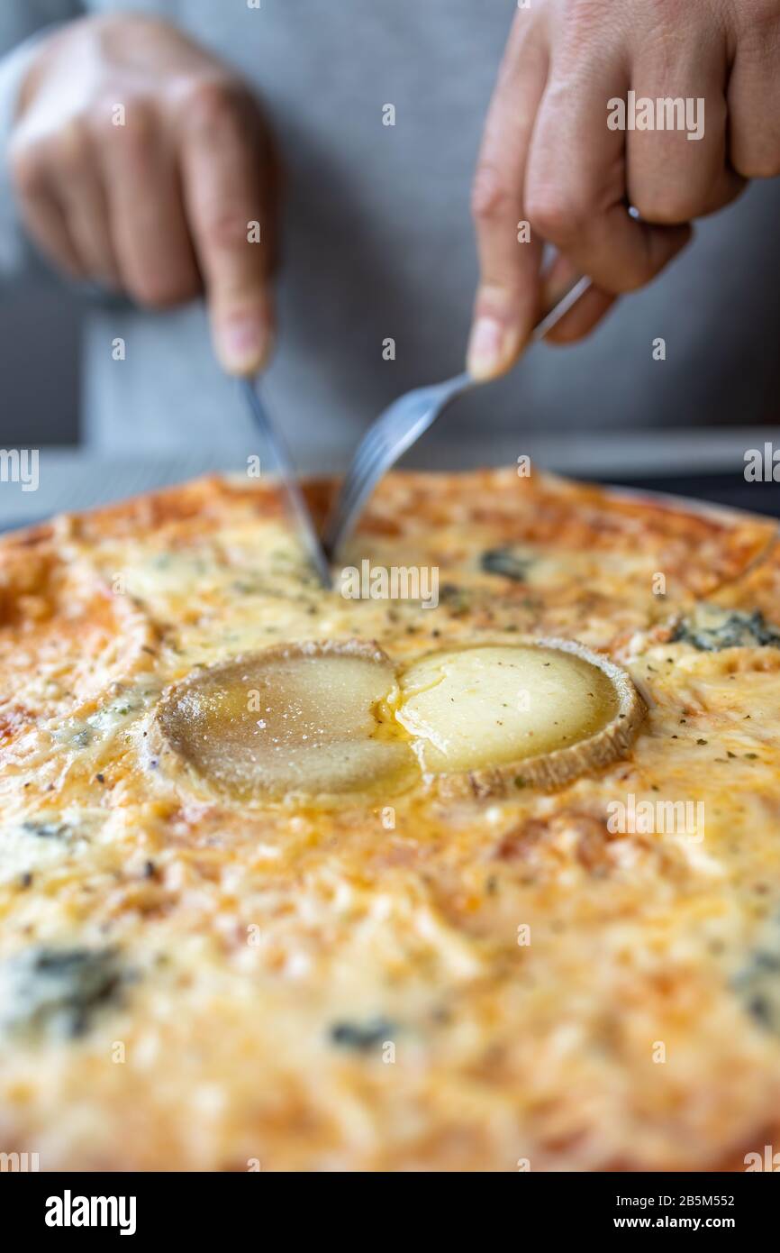 Delicious cheese pizza close-up in restaurant Stock Photo - Alamy