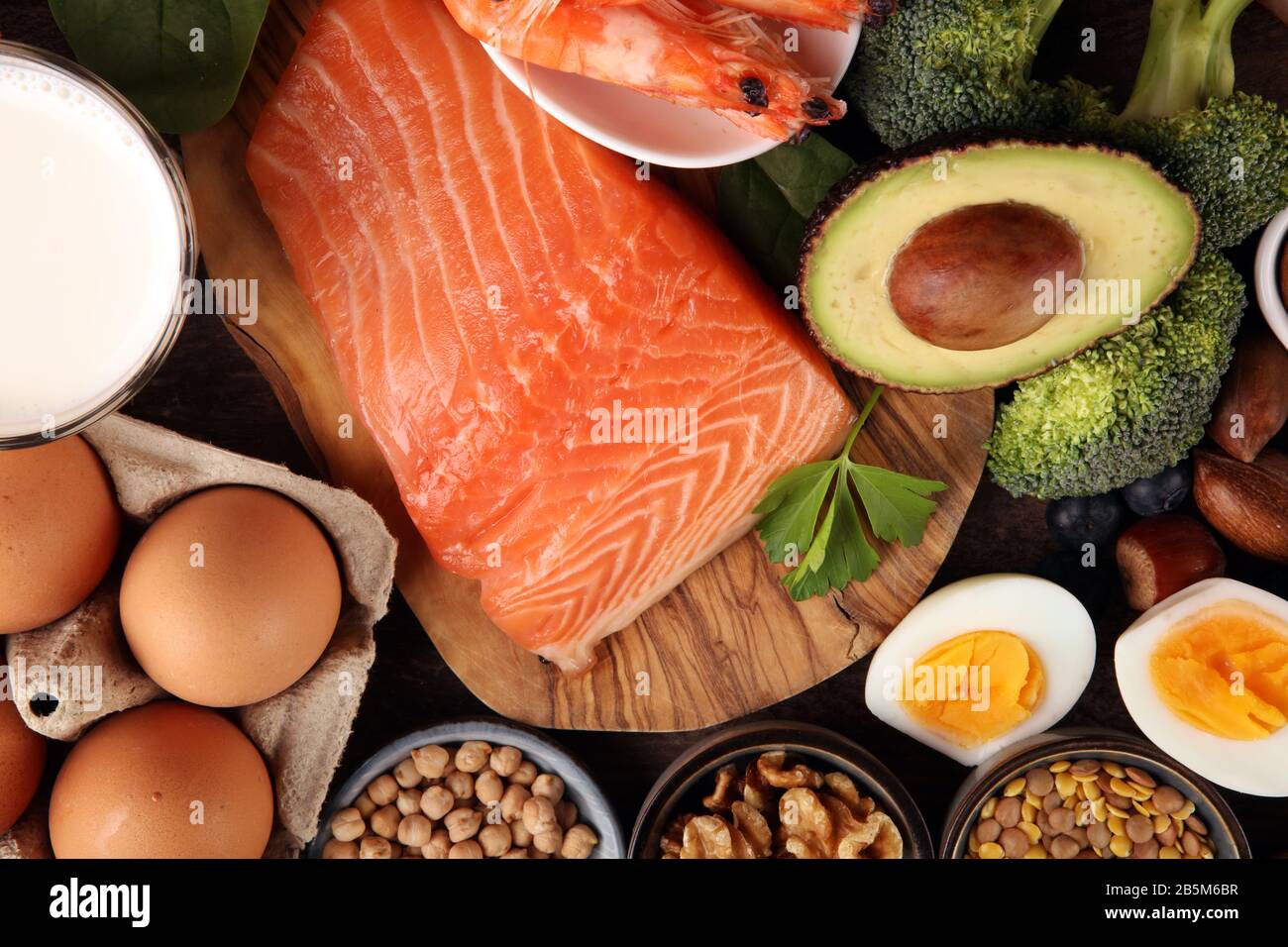 healthy eating and diet concept - natural rich in protein food on table ...