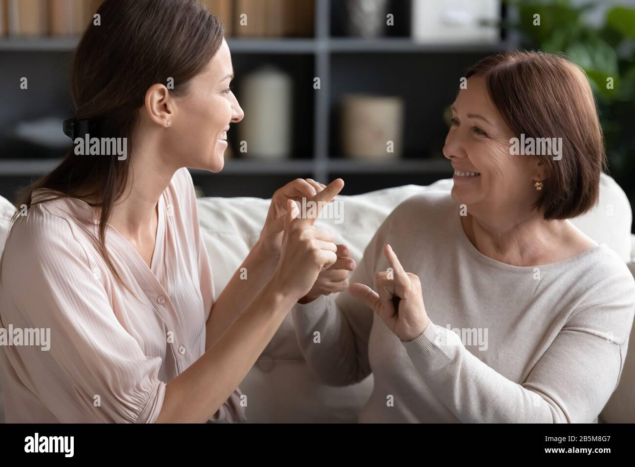 Impaired disabled two generations family using sign language Stock ...