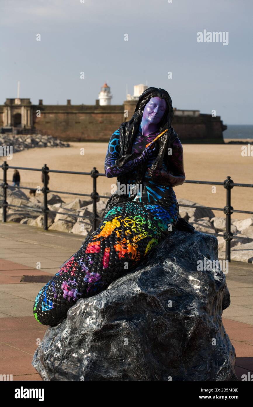 Mermaid on rock hi-res stock photography and images - Alamy