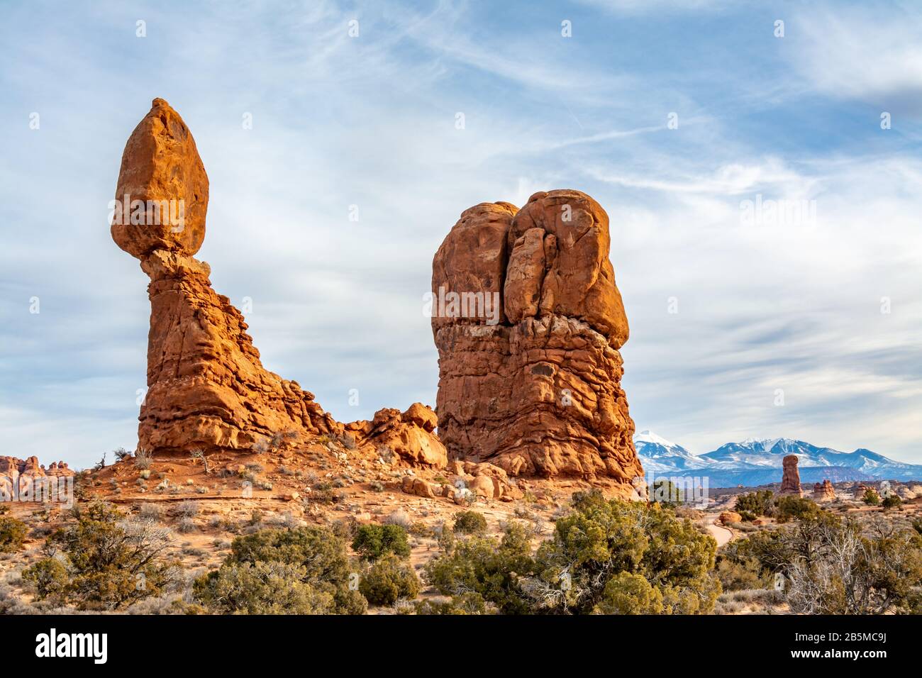 Balanced Rock towering over the desert landscape in Arches National ...