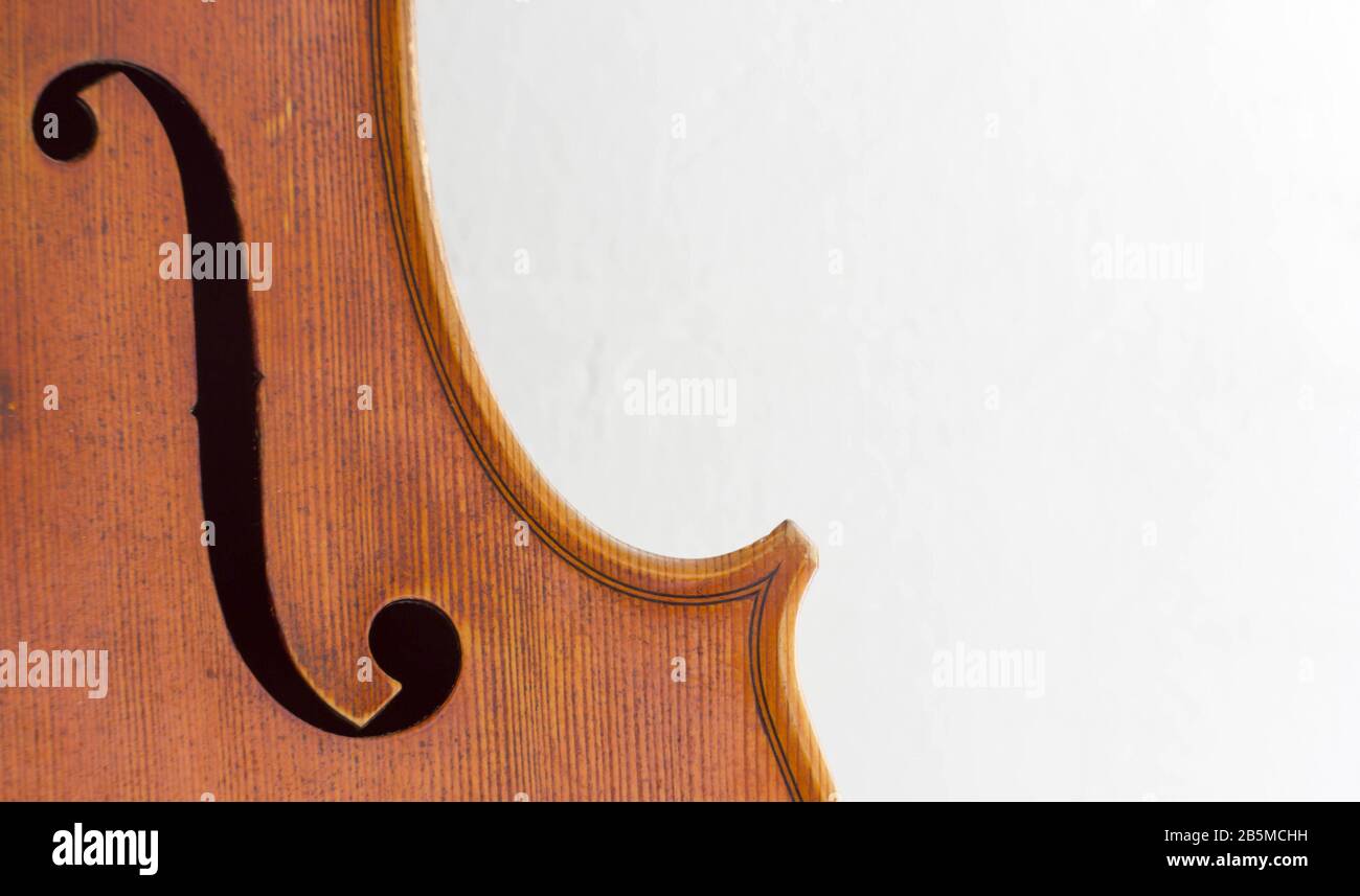 light brown cello on white background Stock Photo - Alamy