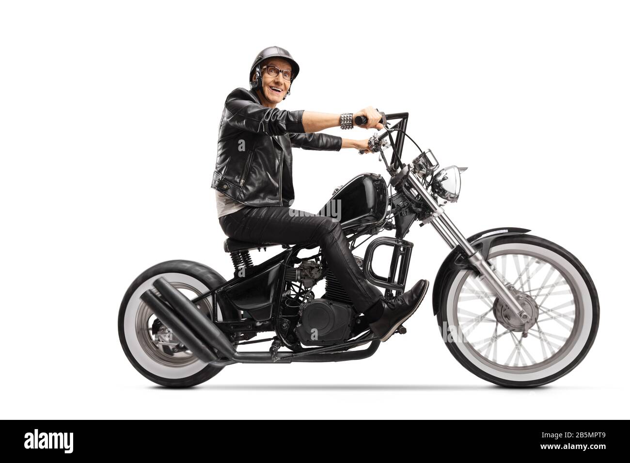 Elderly man riding a customized chopper motorbike isolated on white ...