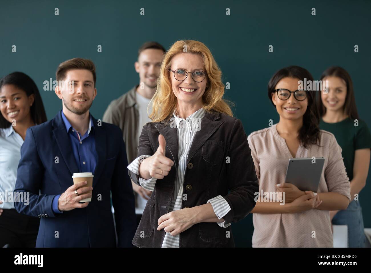Multiracial businesspeople show thumb up recommend good company service ...