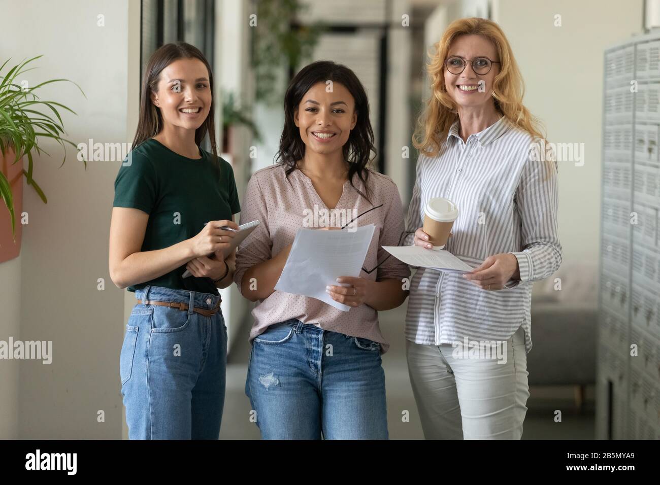 Diverse female colleagues cooperate hi-res stock photography and images ...