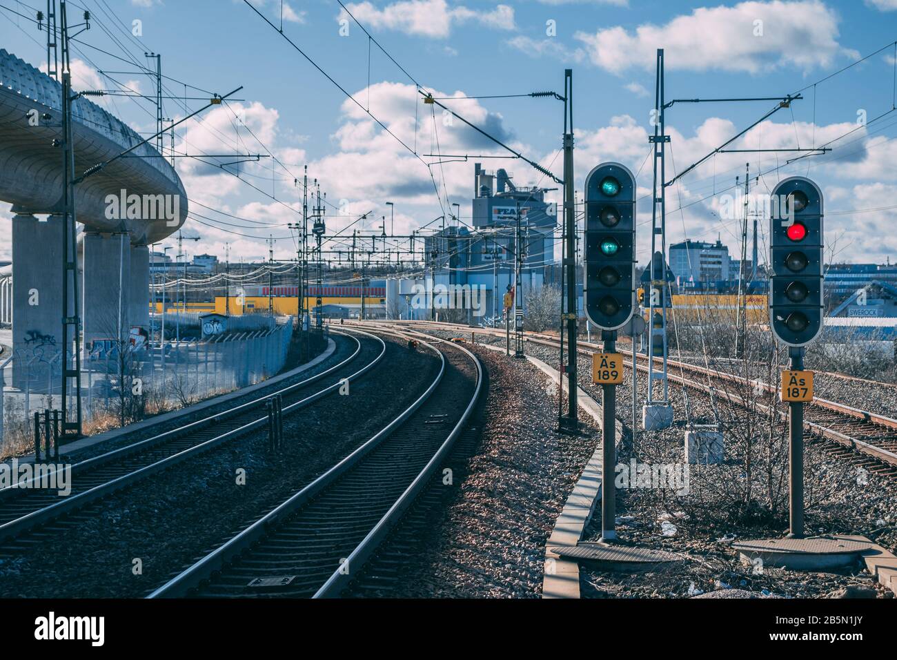 Green and red light signal by the train track Stock Photo - Alamy