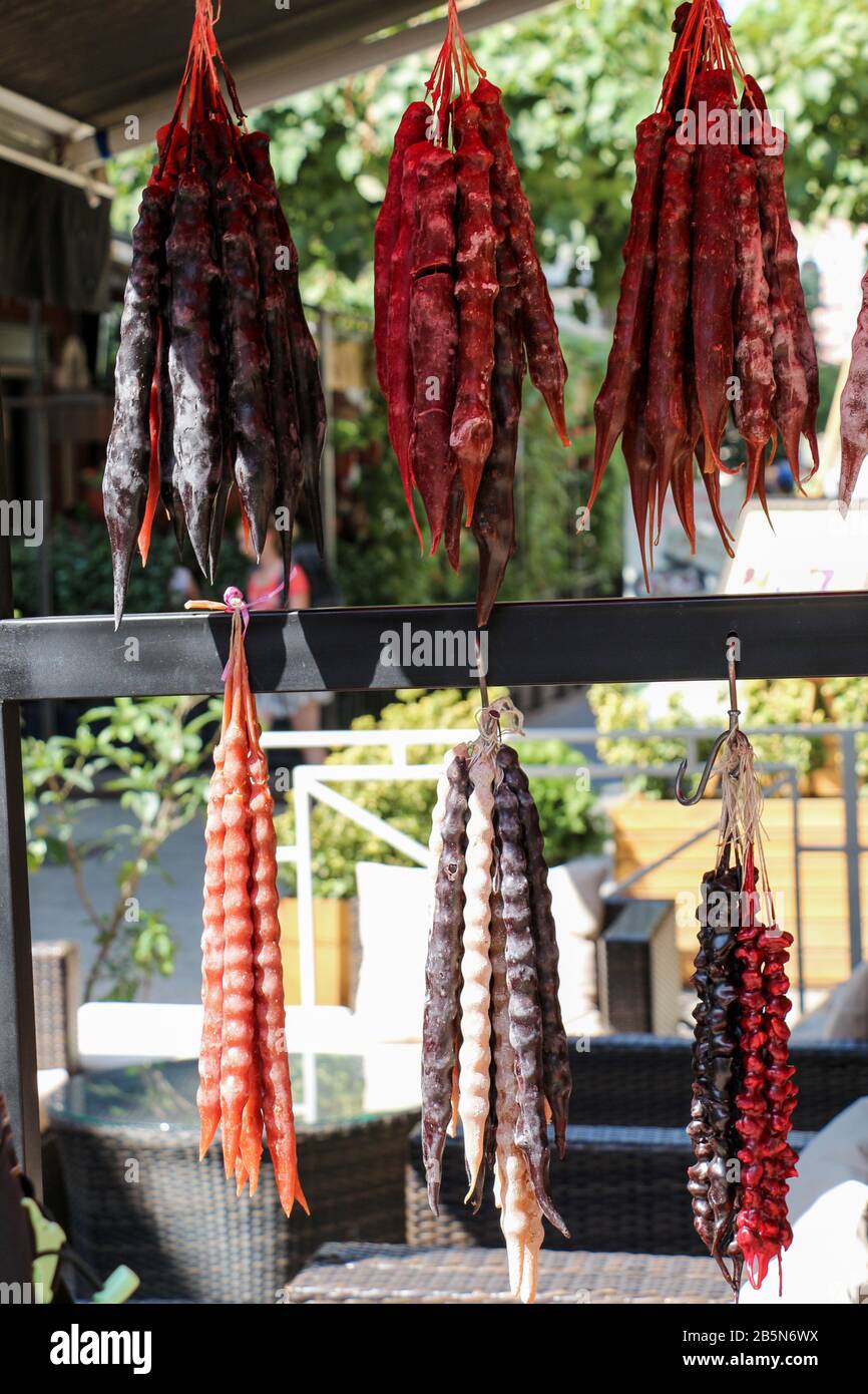 Traditional sausage-shaped candies with walnut in it Stock Photo - Alamy