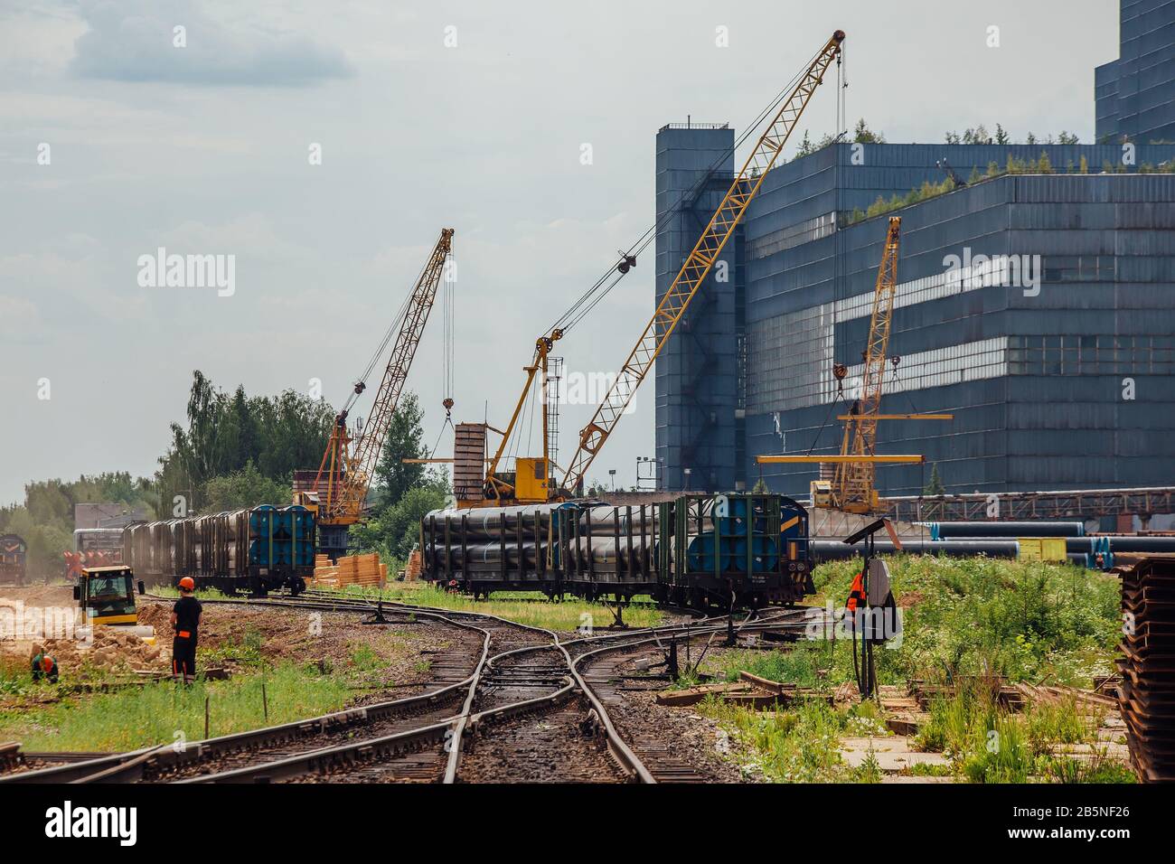 Freight trains with cargo on railroad junction Stock Photo - Alamy