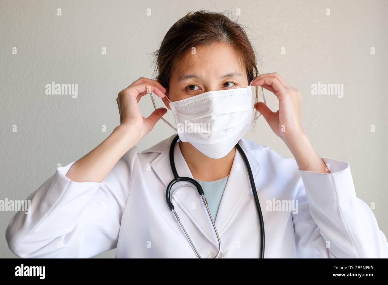 lady or woman doctor wear the medical mask to protect infection from ...