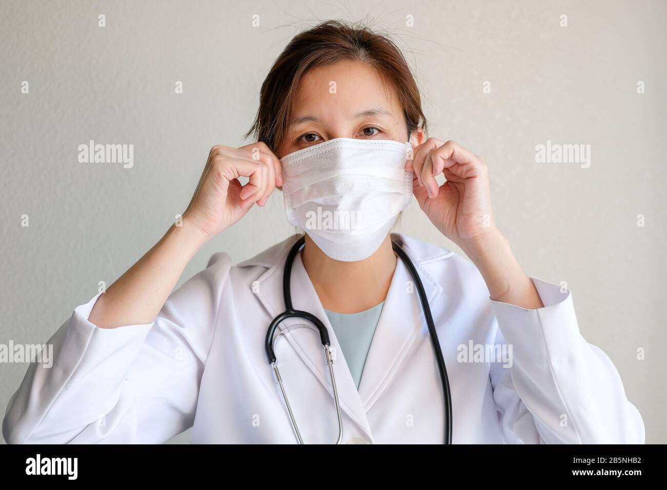 lady or woman doctor wear the medical mask to protect infection from ...