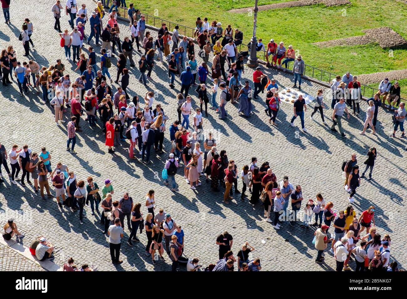 Overtourism, mass tourism, lines of tourists waiting to buy entrance ...