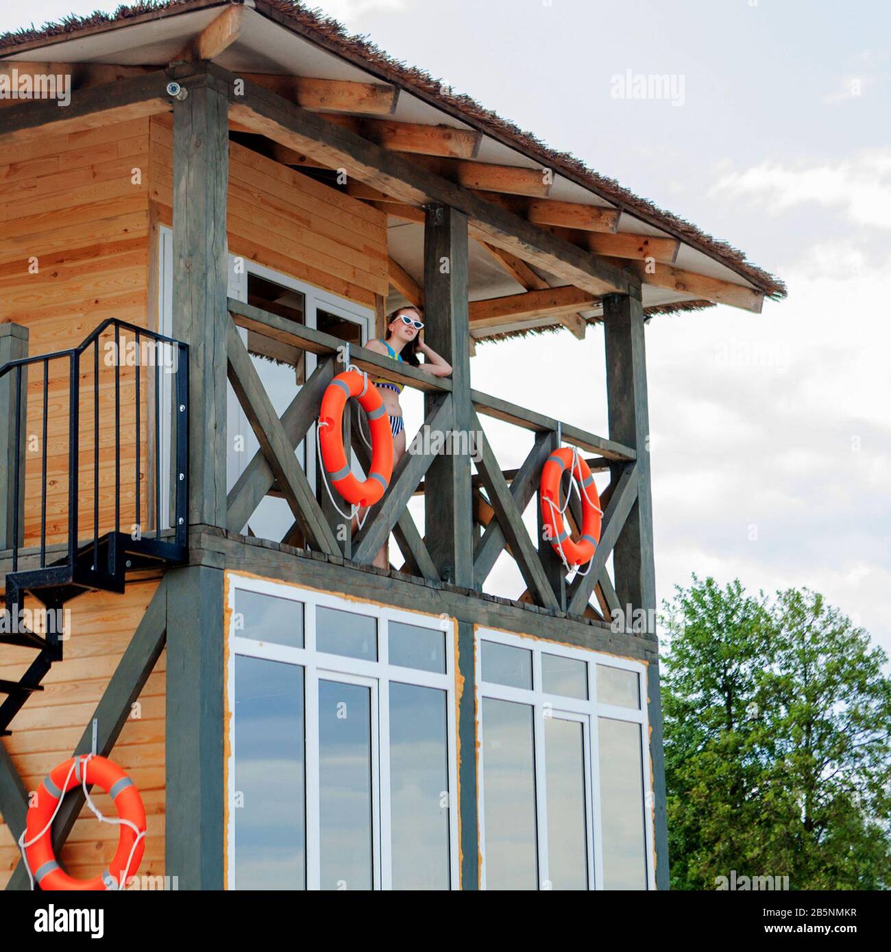 Lifeguard tower for rescue baywatch on beach. Wooden house on sea shore ...