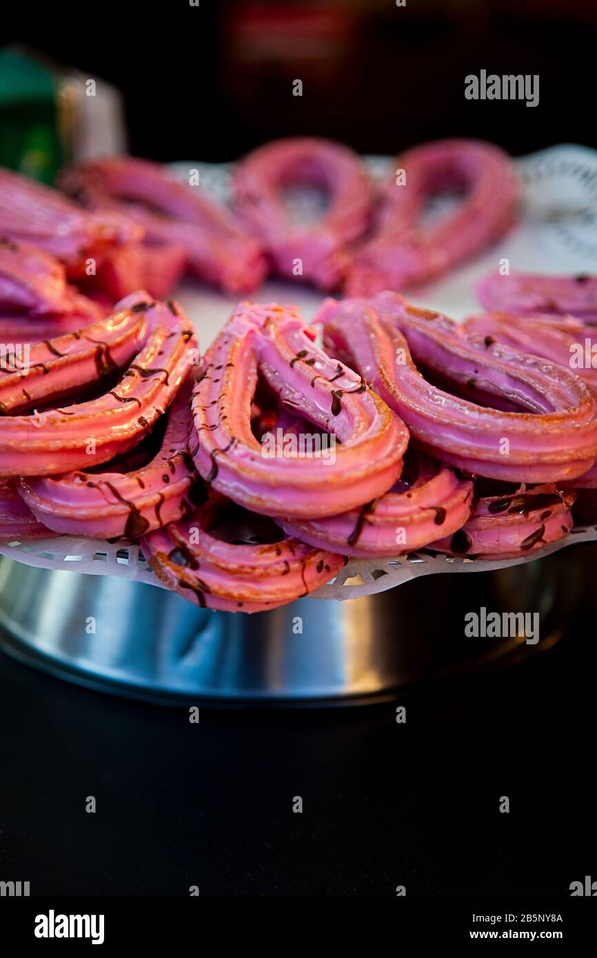 Strawberry and chocolate glazed churros stock photo Stock Photo - Alamy