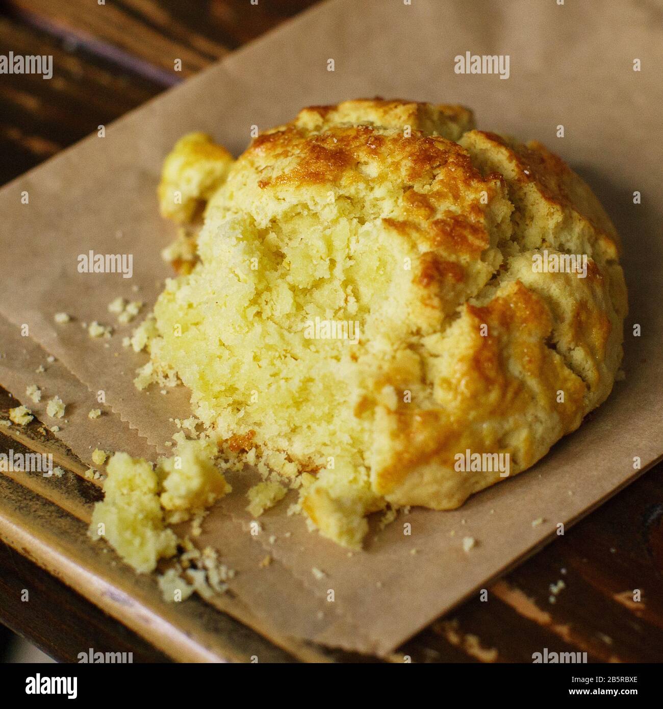 Crumbly scone on parchment paper Stock Photo - Alamy