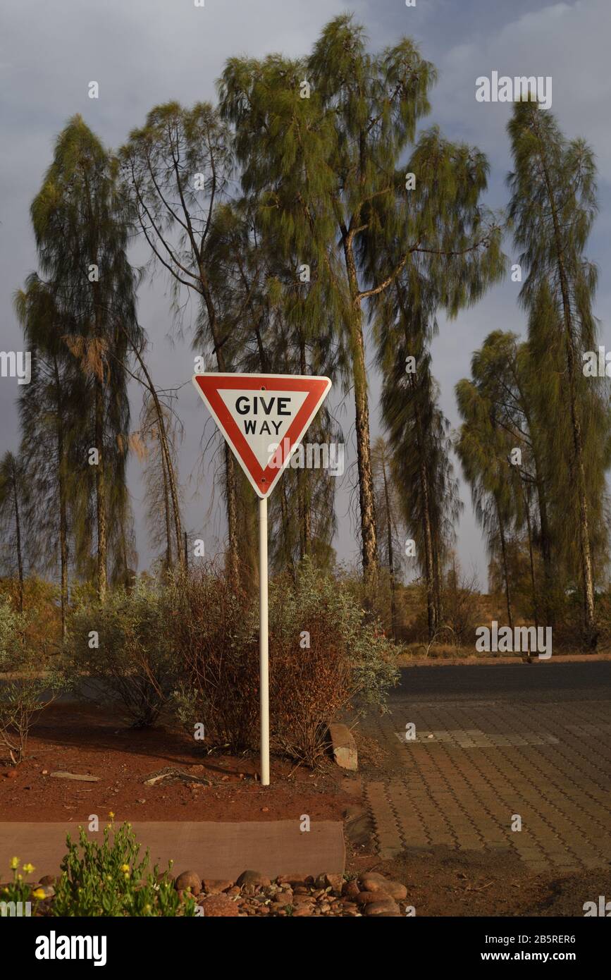 A give way sign at at a driveway intersection, Sails in the Desert ...