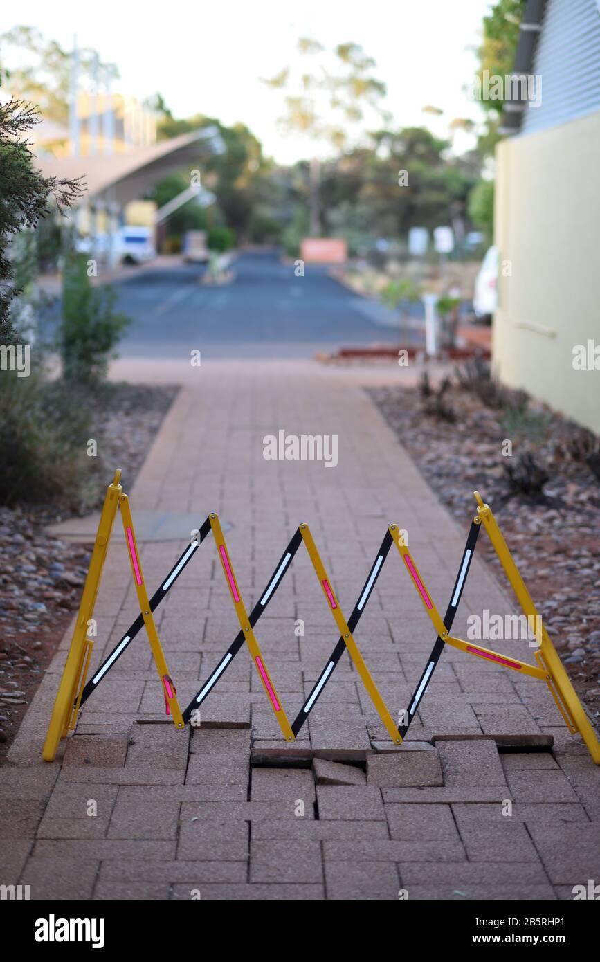 a ridge of paving stones pushed up in the heat of the outback at Sails ...