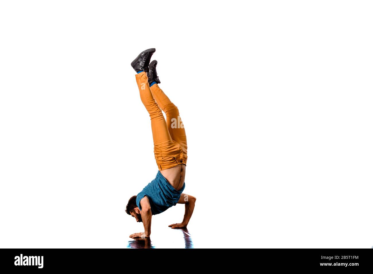 Portrait of a young man dancing of joy. Isolated image on white ...