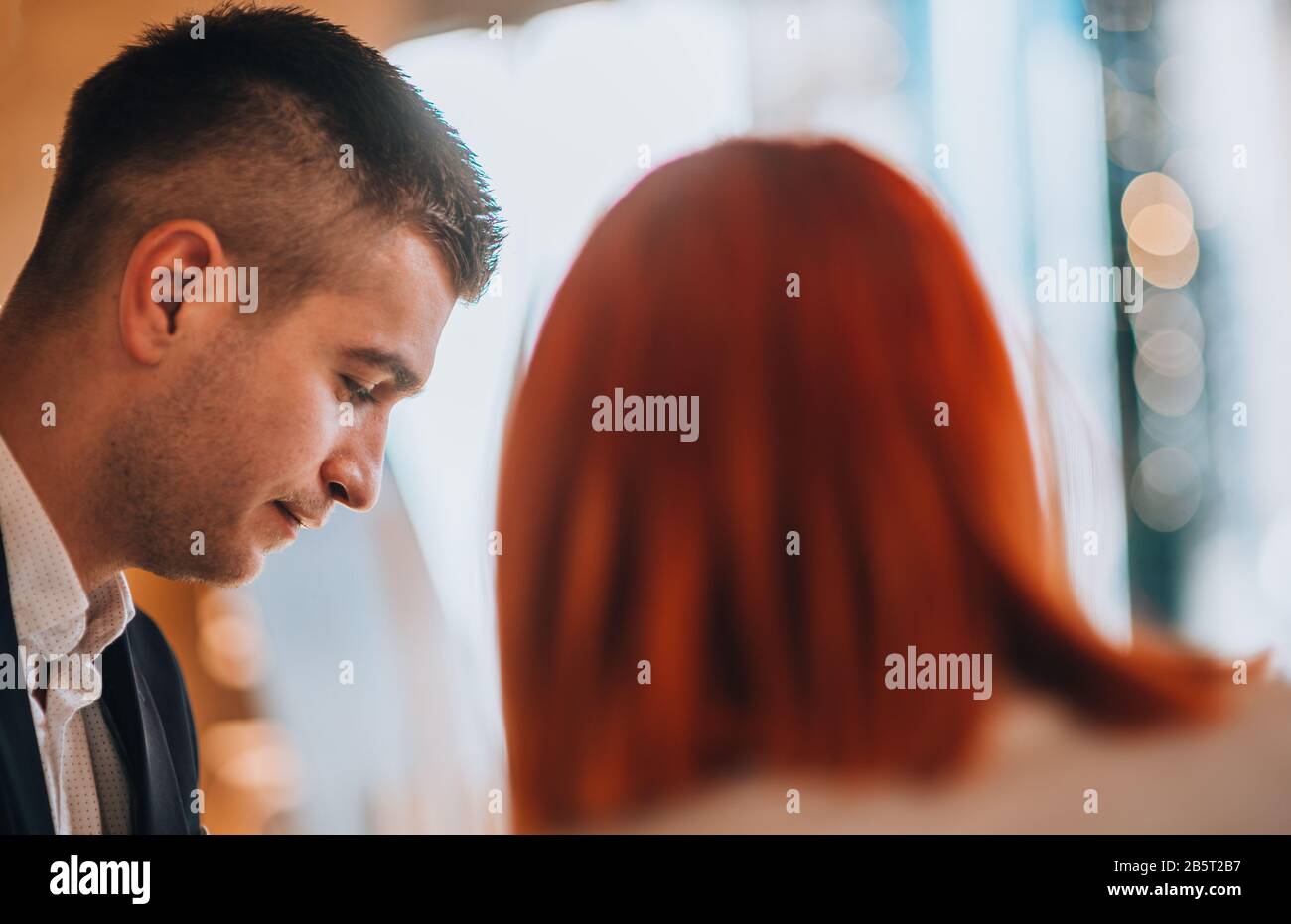 Group of coworkers hanging out in a coffee shop during a business ...
