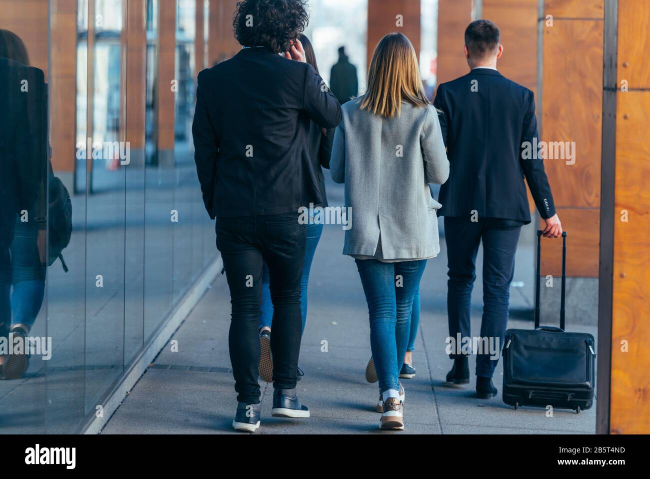 Group of colleagues on a business trip (euro trip) walking together at ...