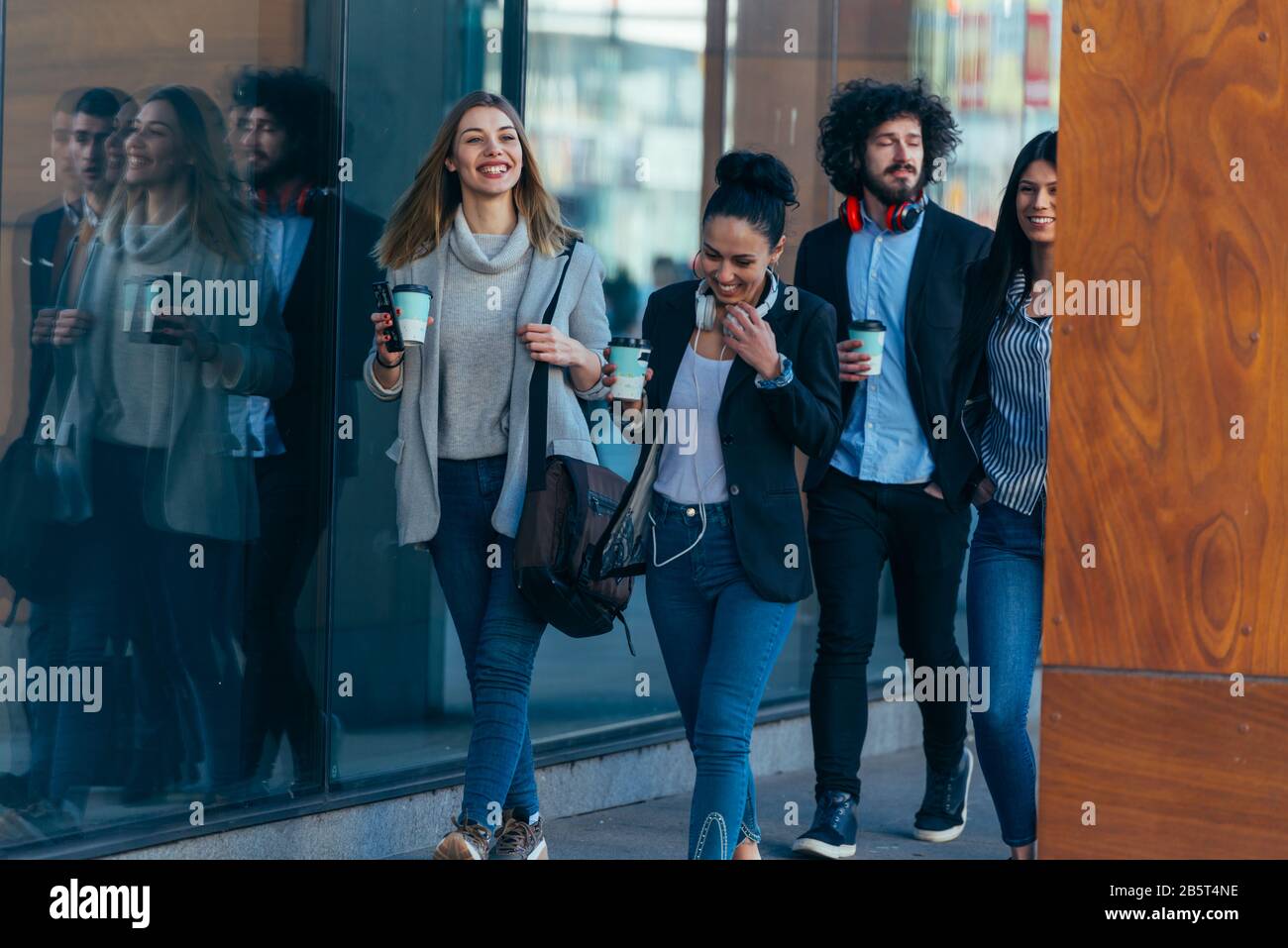 Group of colleagues on a business trip (euro trip) walking together at ...
