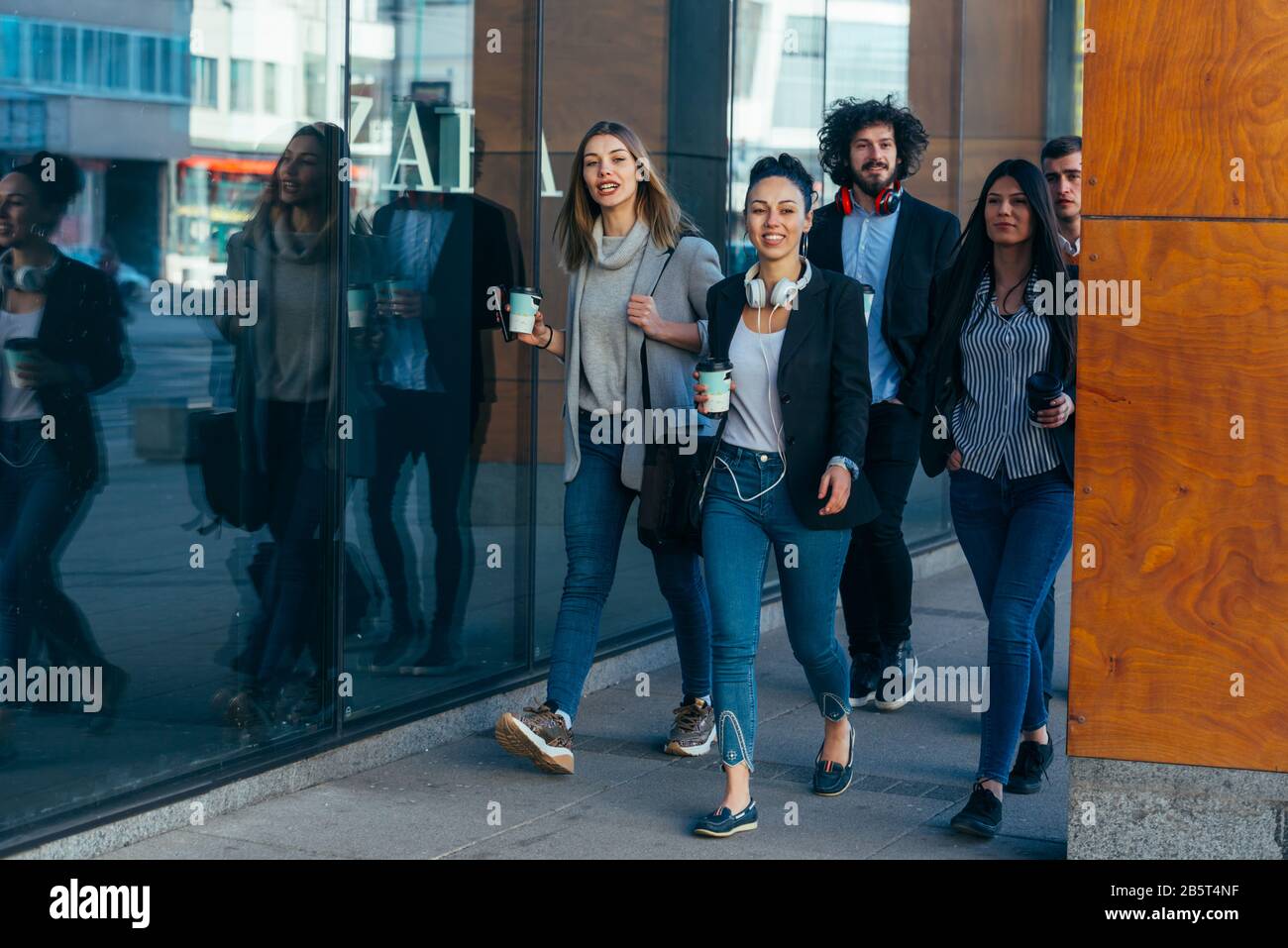 Group of colleagues on a business trip (euro trip) walking together at ...