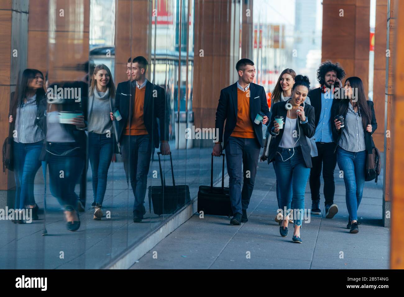 Group of colleagues on a business trip (euro trip) walking together at ...