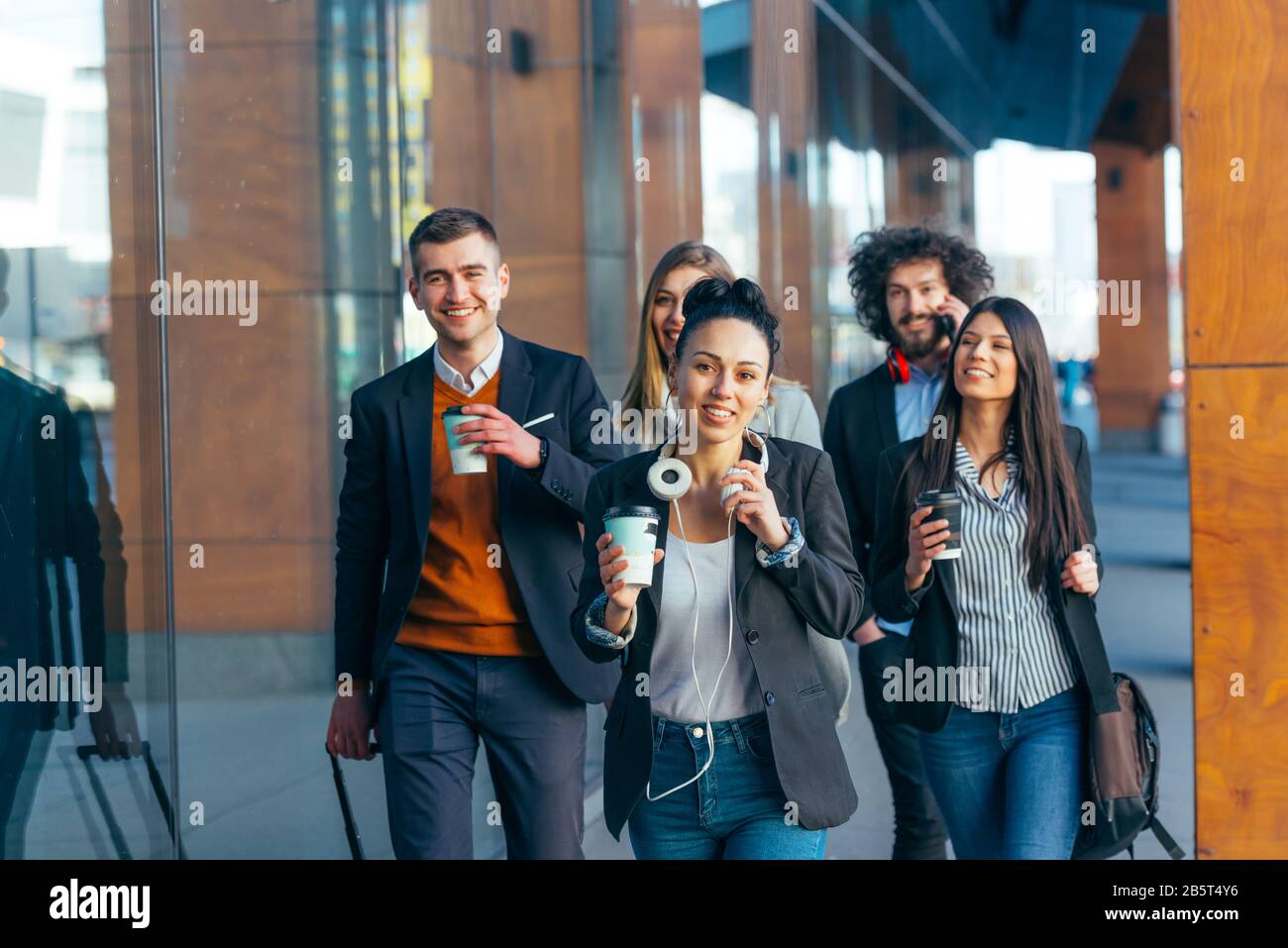 Group of colleagues on a business trip (euro trip) walking together at ...