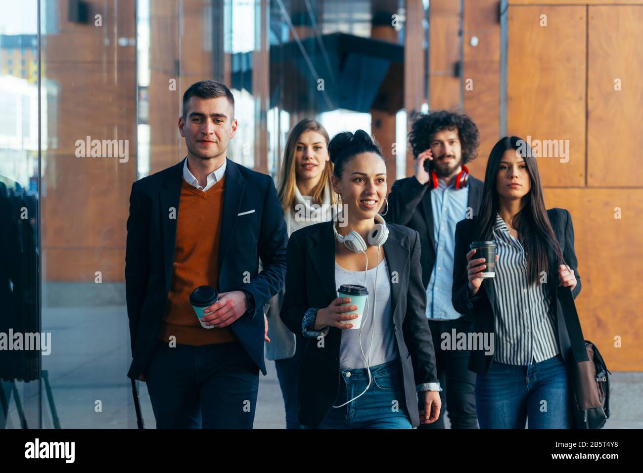 Group of colleagues on a business trip (euro trip) walking together at ...