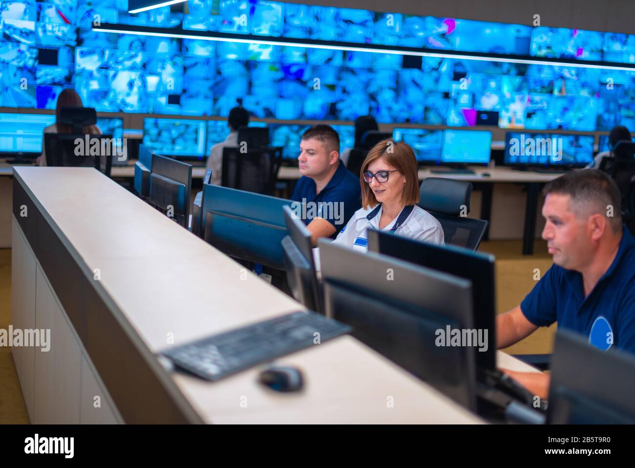 Group of Security data center operators (administrators) working in a ...