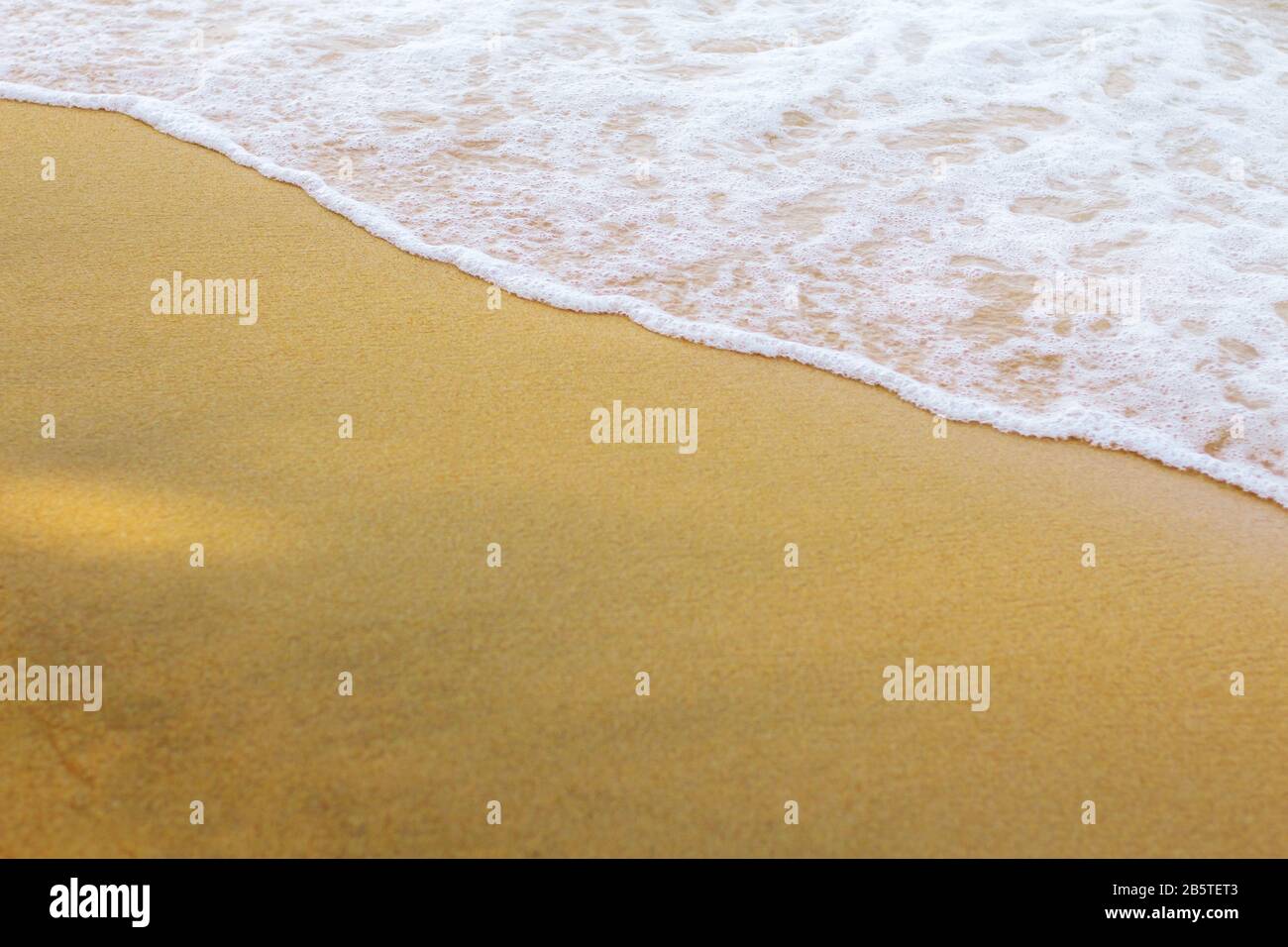 Waves on sand beach at the sea Stock Photo - Alamy