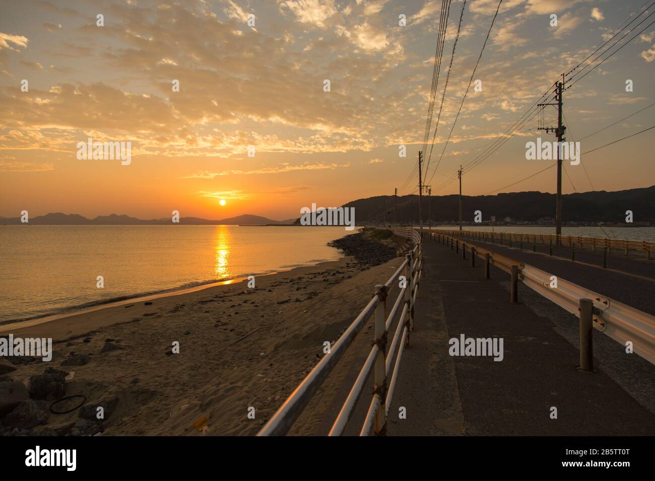 Japan sunset sea and sandy beach Stock Photo - Alamy
