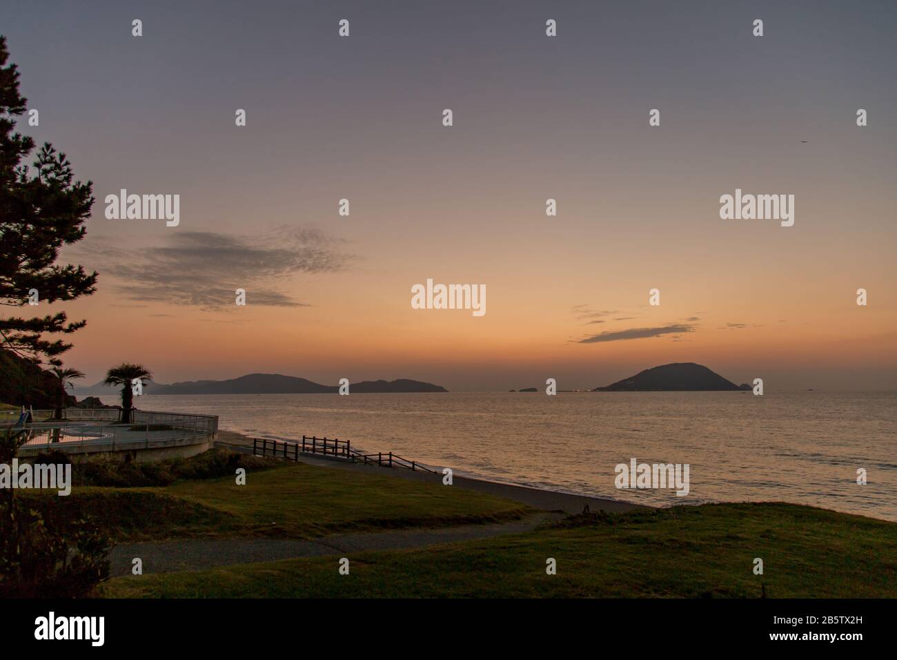 Japan sunset sea and sandy beach Stock Photo - Alamy