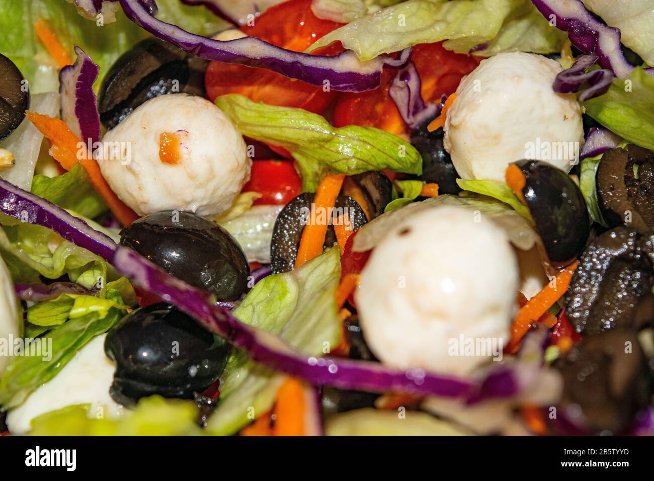 Vegetable salad with mozzarella. Surface texture. Close up Stock Photo ...