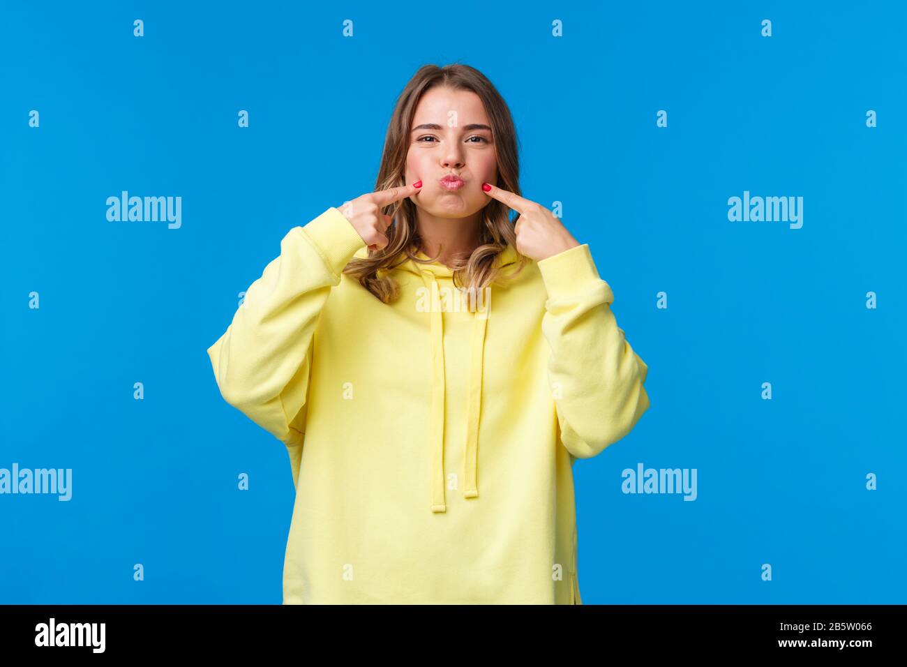 Women, lifestyle and emotions concept. Portrait of silly carefree girl ...