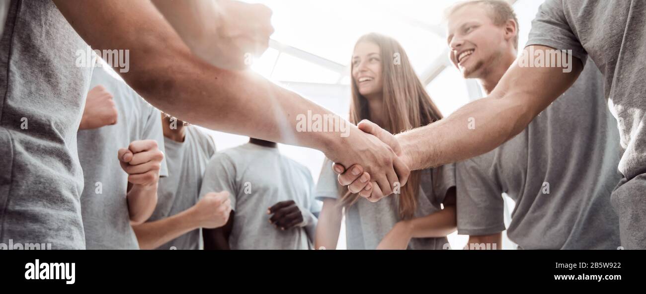 handshake of young people in a circle of friends Stock Photo - Alamy
