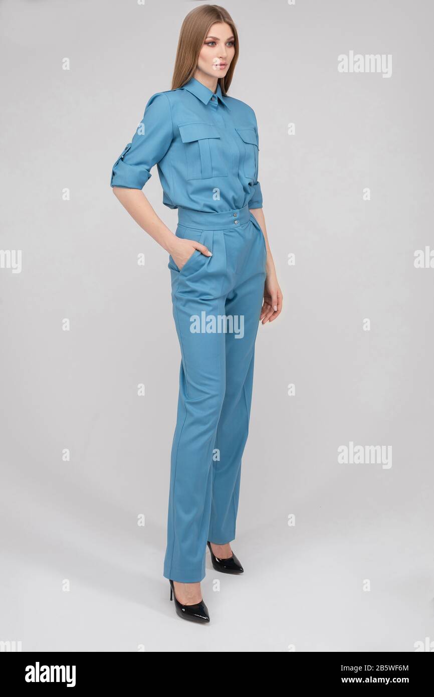 Beautiful young model in blue suit and heels Stock Photo - Alamy