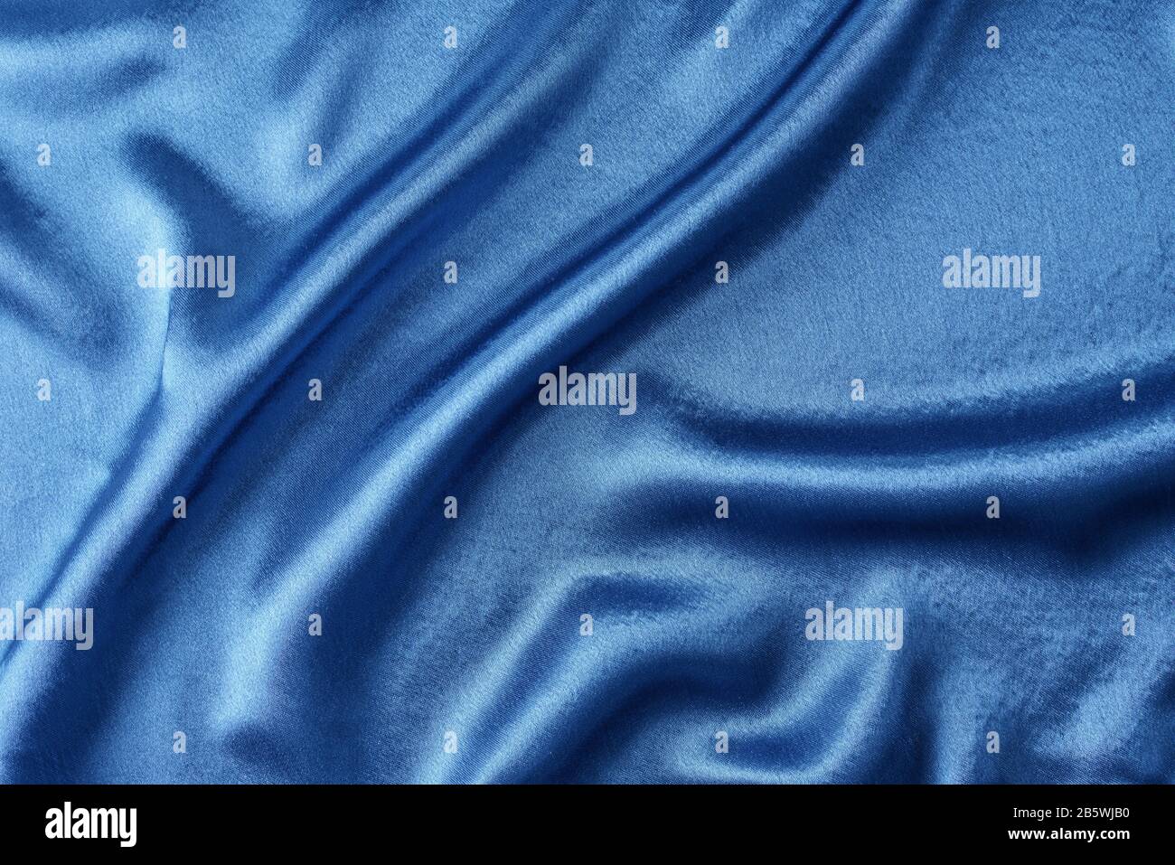 Blue silk background with folds. Abstract texture of rippled satin ...