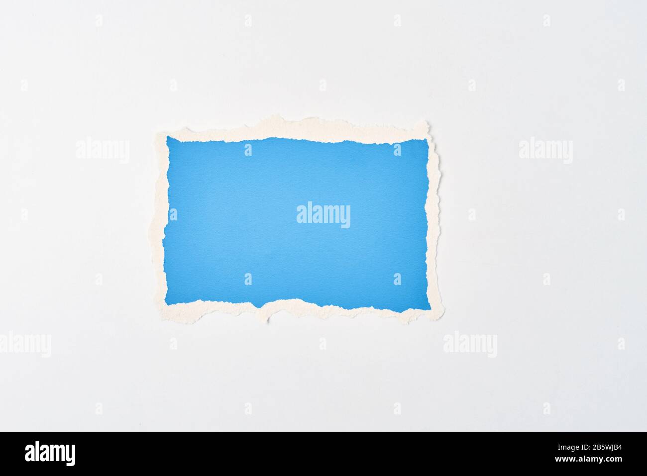 Ripped blue paper torn edge sheet on white background. Template with ...