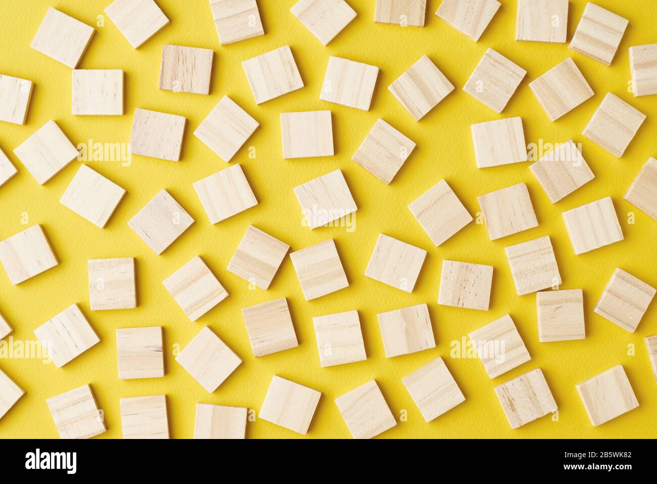 Empty wooden blocks pattern on yellow background, top view Stock Photo ...