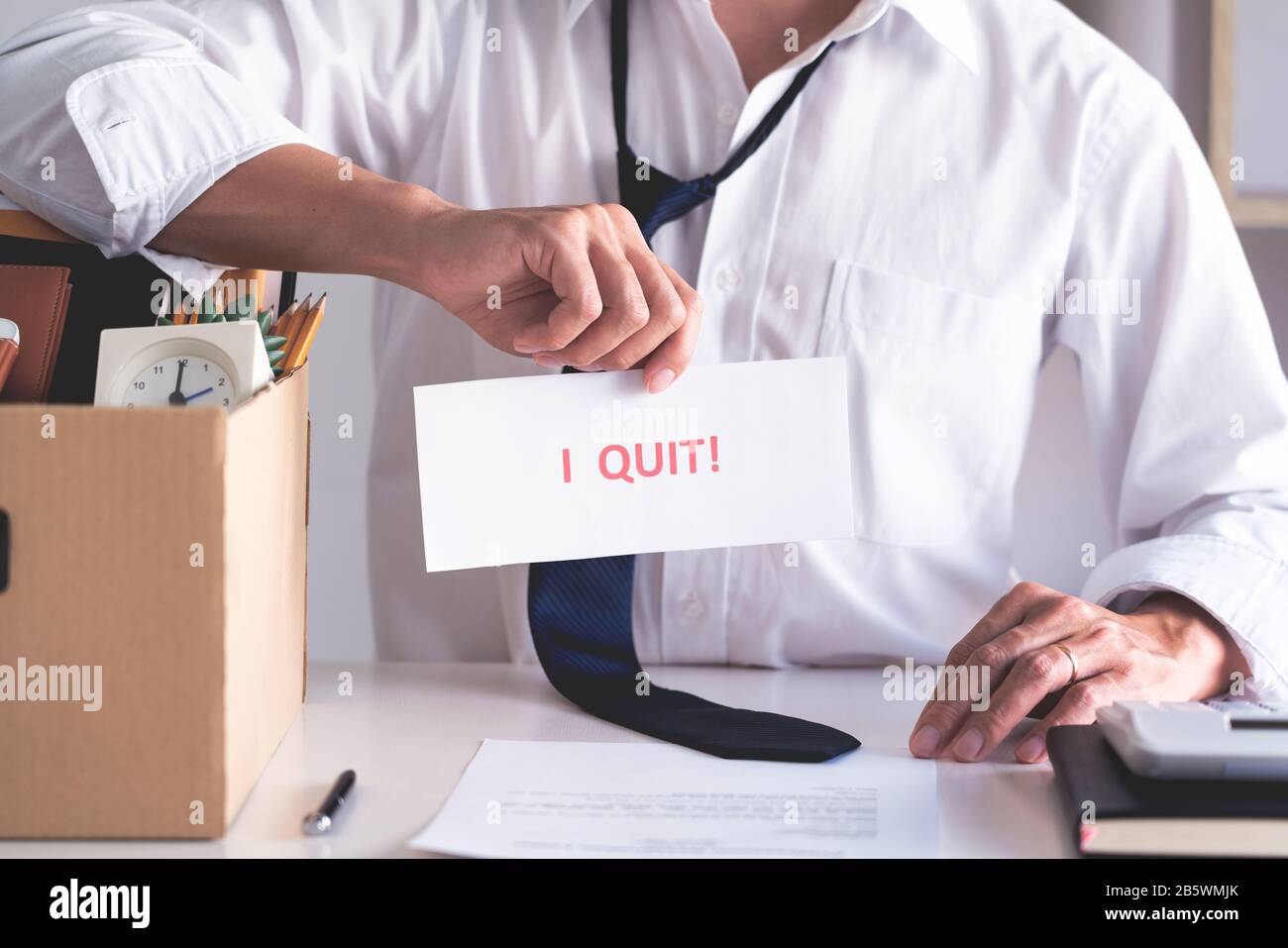Businessman holding with I quit words card letter, resign employee ...