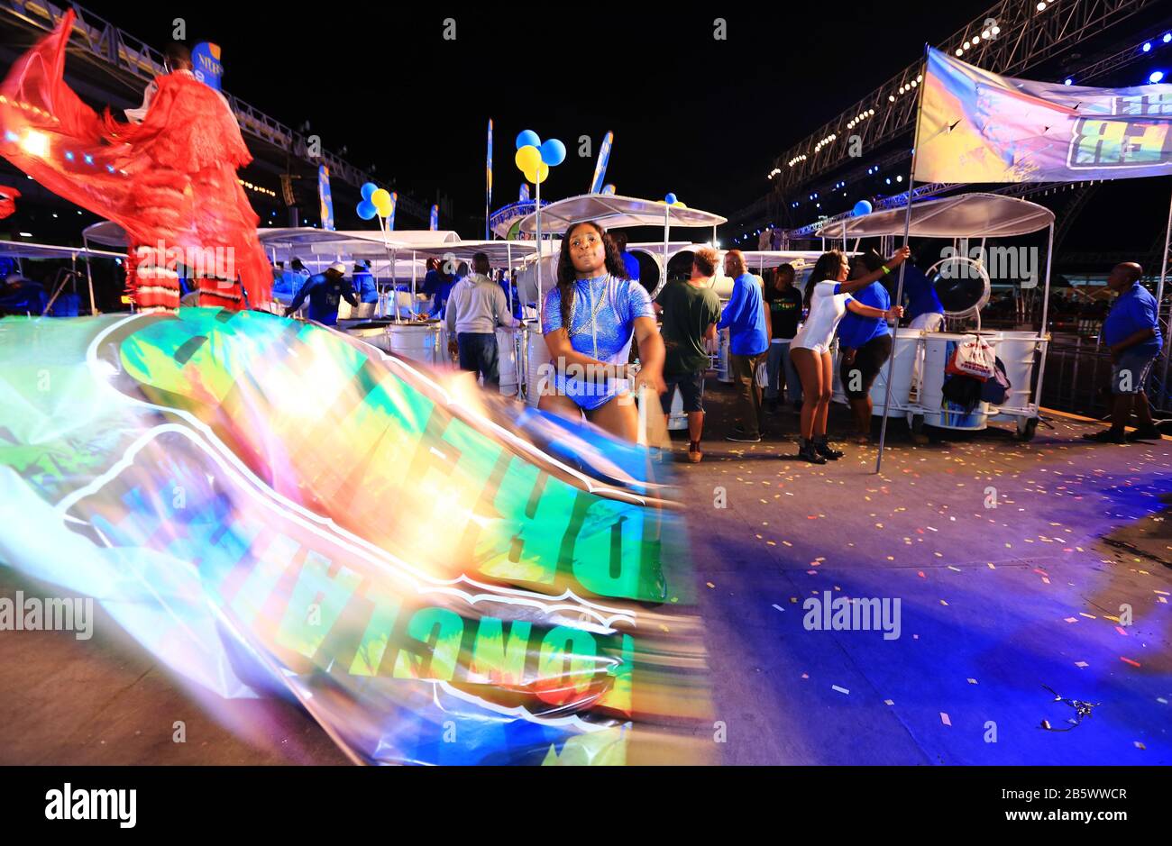 PORT OF SPAIN, TRINIDAD - FEB 22: Moko jumbies and flagwomen perform as ...