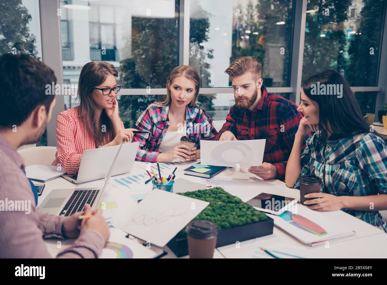 Busy team of managers working hard to end project Stock Photo - Alamy